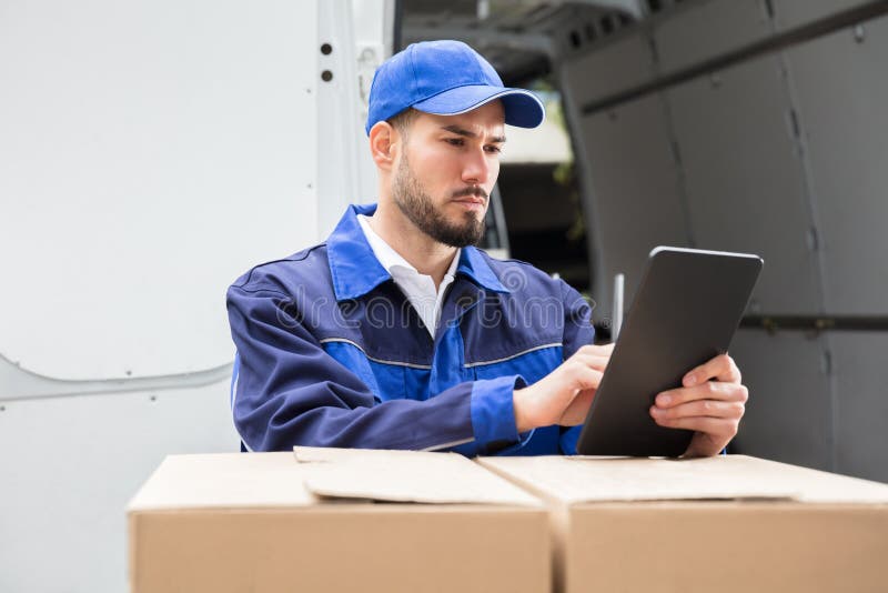 Male Worker Using Tablet stock photo. Image of front - 218382794