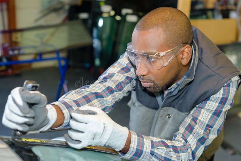Male Worker Using Tool To Fit Windshield Stock Photo - Image of service ...