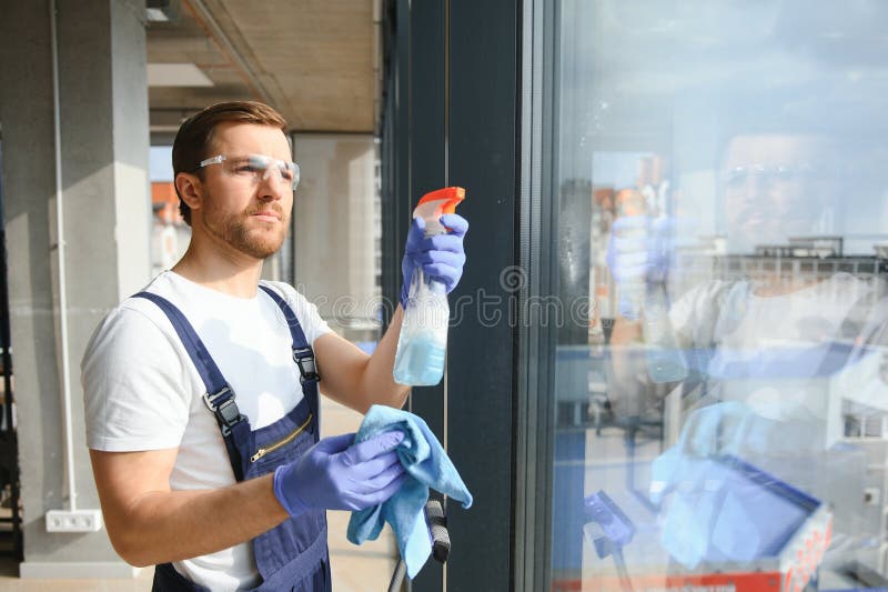 Male Worker Washing Window Glass Stock Photo - Image of detergent ...