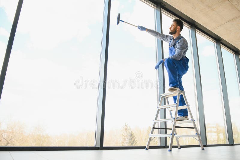Male Worker Washing Window Glass. Stock Image - Image of background ...