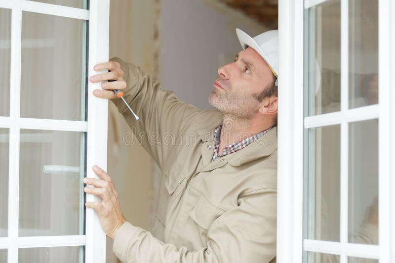 Male Worker during Window Installation Stock Photo - Image of tool ...