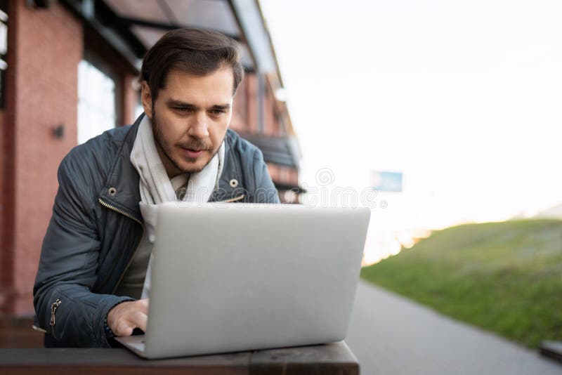 Male it Worker Working on Laptop Outside Stock Image - Image of person ...