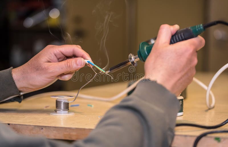 Male Worker Works with Solder Wire Stock Photo - Image of repair ...