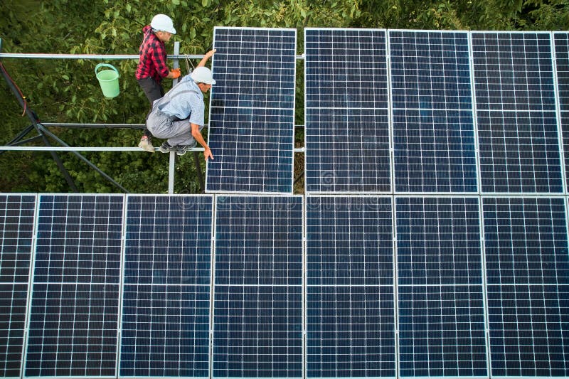 Male Workers Installing Solar Panel System Outdoors. Stock Photo ...