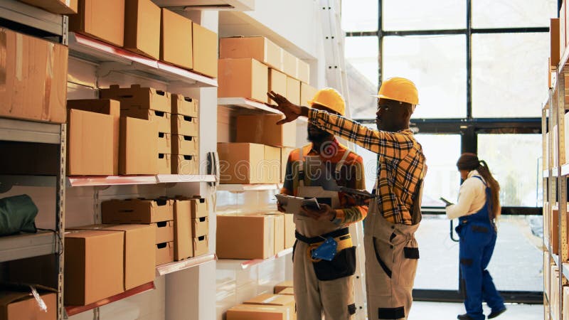 Male Workers Using Laptop and Lists of Logistics Stock Photo - Image of ...
