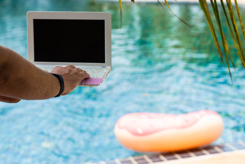 Male Working on His Laptop, Sitting by the Pool. Male Hands on the ...
