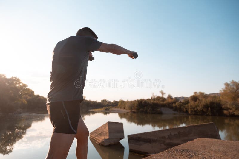 Male Working Put Next To the River in the Early Morning Stock Image ...