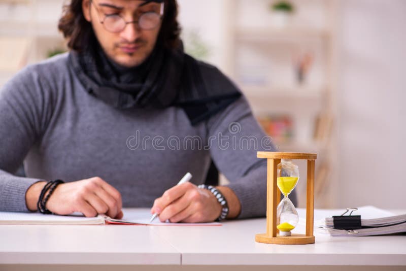 Young Male Writer in Time Management Concept Stock Image - Image of ...