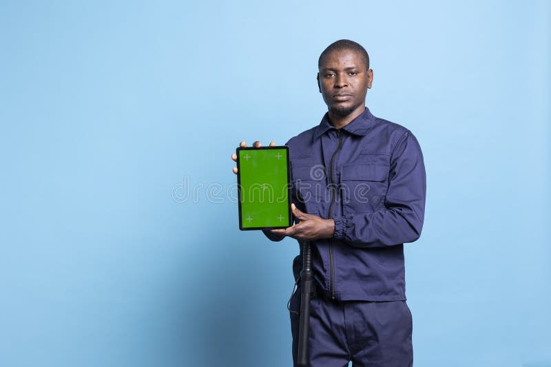 Mall Security Bodyguard Presenting Greenscreen on a Tablet in Studio ...