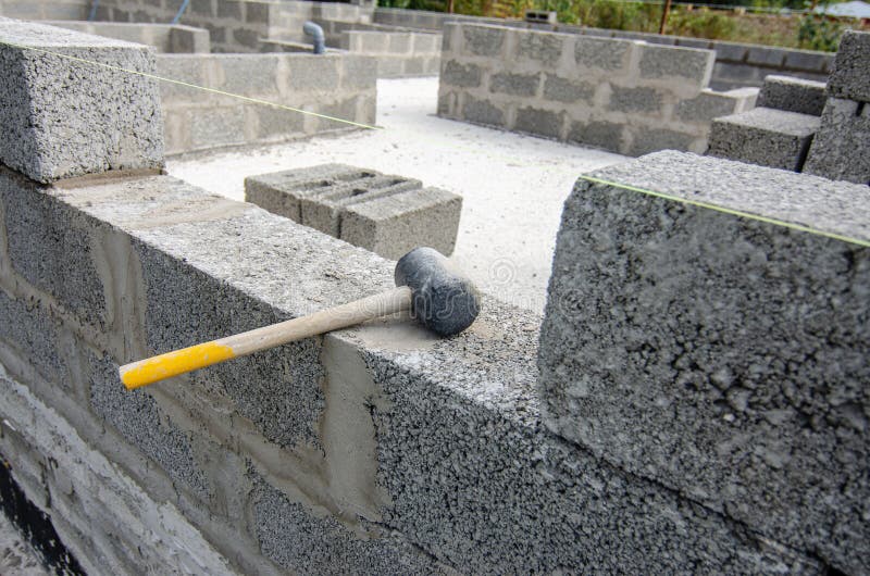 A Mallet Lies on a Part of a Wall Made of Expanded Clay Concrete Blocks ...