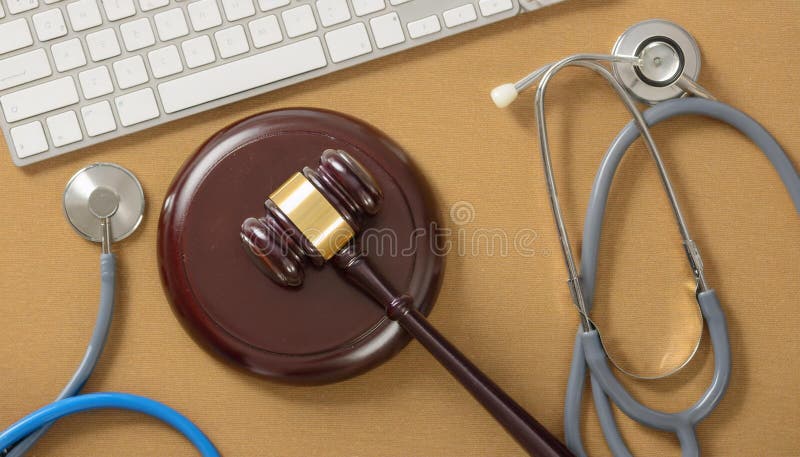 Mallet and Stethoscope on Gavel Over the Office Desk Stock Illustration ...