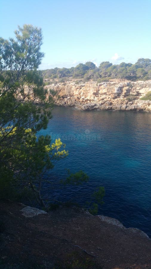 Mallorca blue water beach stock photo. Image of loch - 104355706