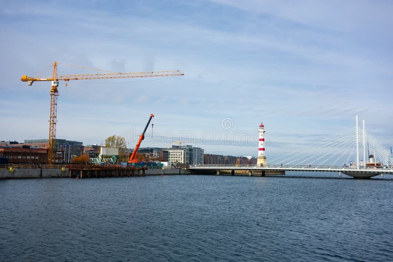 Malmo Lighthouse and Industrial Cranes on Construction Site and ...