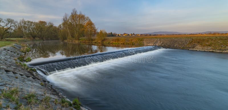 Sunrise at a weir stock image. Image of waterfall, cloud - 242821729