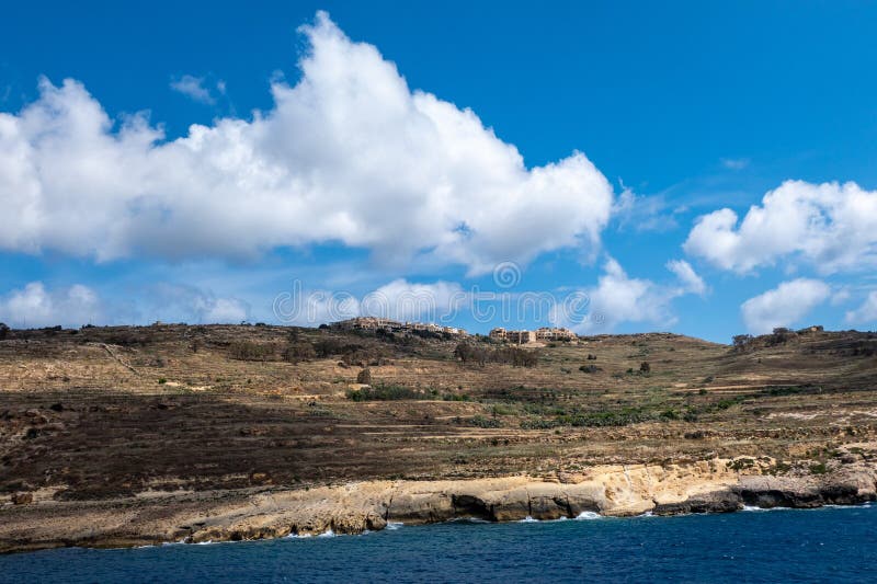 Malta, Village of Gozo Island with Cumulus Clouds Stock Photo - Image ...