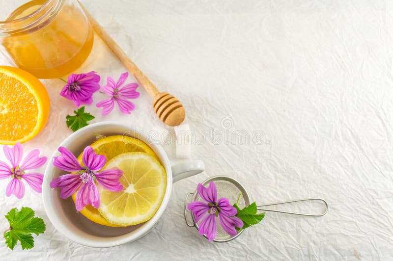 Malva Sylvestris, Mallow, Tea with Lemon and Flowers Stock Photo ...