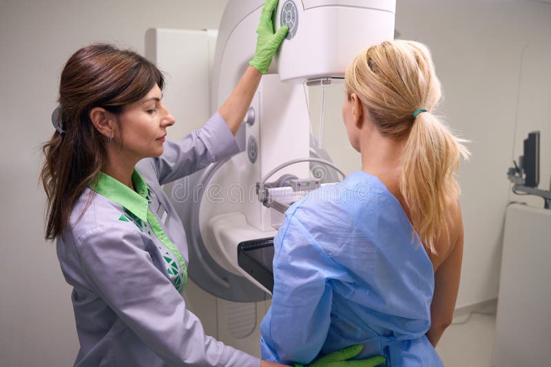 Experienced Radiologic Technologist Preparing Female for Mammogram ...