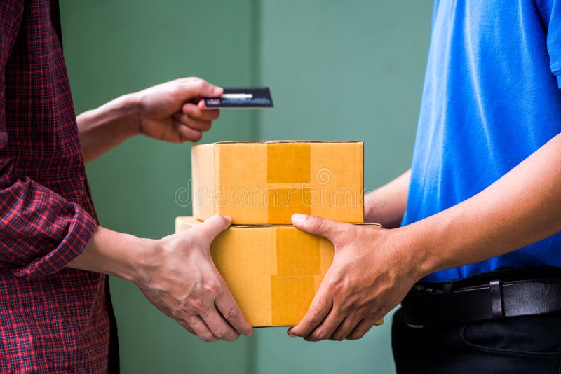 Man Accepting a Delivery of Boxes from Deliveryman. Stock Photo - Image ...