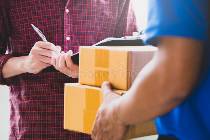 Man Accepting a Delivery of Boxes from Deliveryman. Stock Image - Image ...