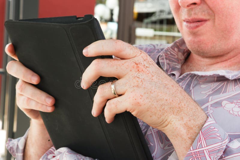 Man Accessing Internet Using His Electronic Tablet Stock Image - Image ...