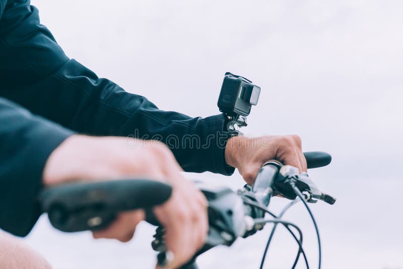Man with an Action Camera on His Hand, Rides a Bicycle Stock Photo ...