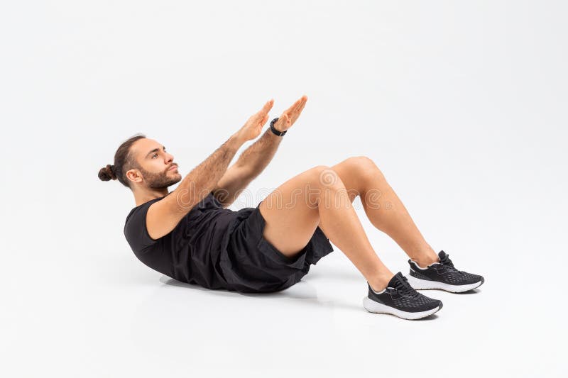 Man Performing Crunch Exercise on Floor on Grey Background Stock Photo ...
