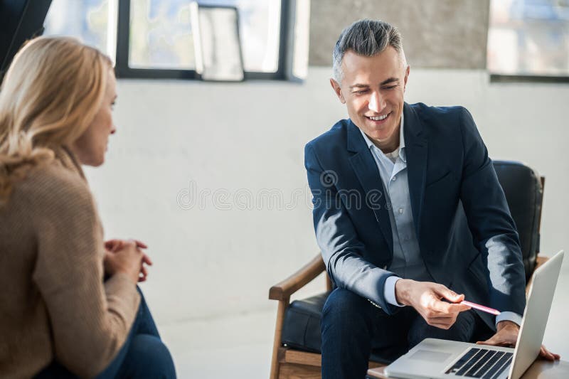 Man Ad Woman Sitting and Discussing Something Stock Photo - Image of ...