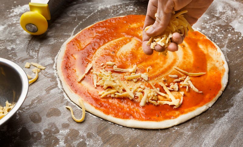 Man Adding Cheese To Pizza at Kitchen Stock Photo - Image of fresh ...