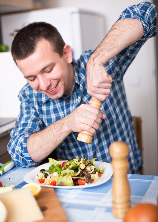 Housekeeping Man Adding Spice To Salad Stock Photo - Image of eating ...
