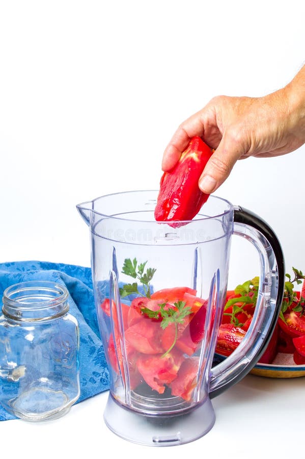 Man Adding Tomato Slices in a Blender for a Smoothie Stock Photo ...