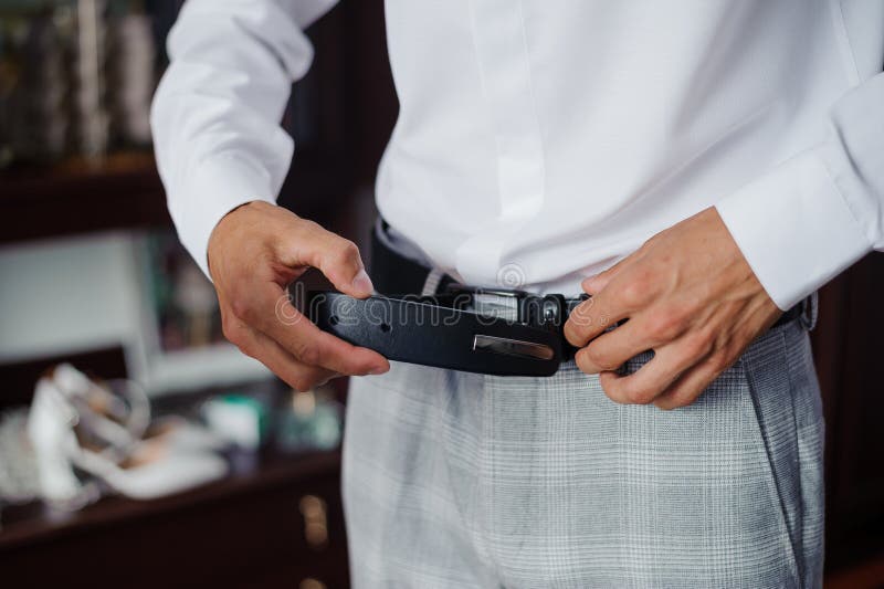 Man Adjusting Belt in Formal Attire Stock Image - Image of material ...