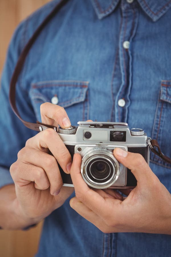 Man adjusting camera lens stock image. Image of closeup - 60556373