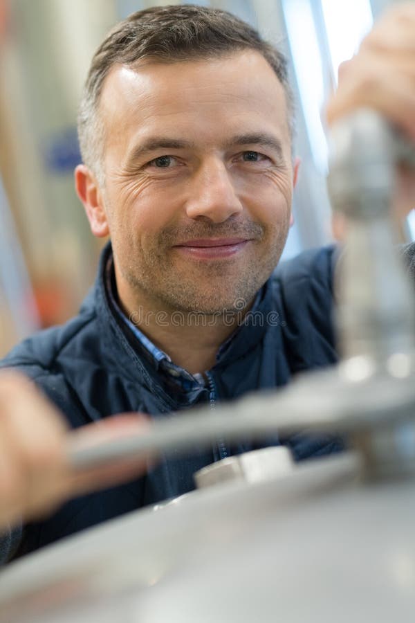 Man Adjusting Container`s Setting Stock Photo - Image of program, smile ...