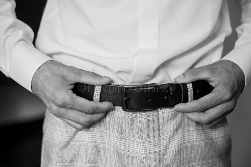 Man Adjusting His Belt in a Stylish Outfit Stock Image - Image of belt ...
