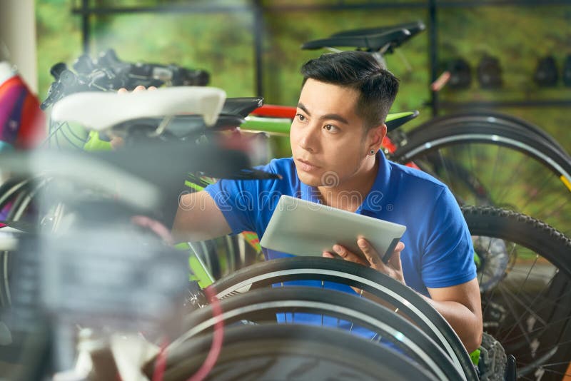 Man adjusting saddle stock image. Image of fixing, sale - 136795593