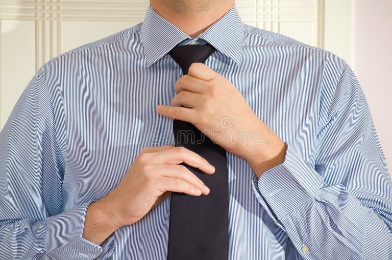 Man Adjusting Tie stock photo. Image of white, hand, work - 16957826