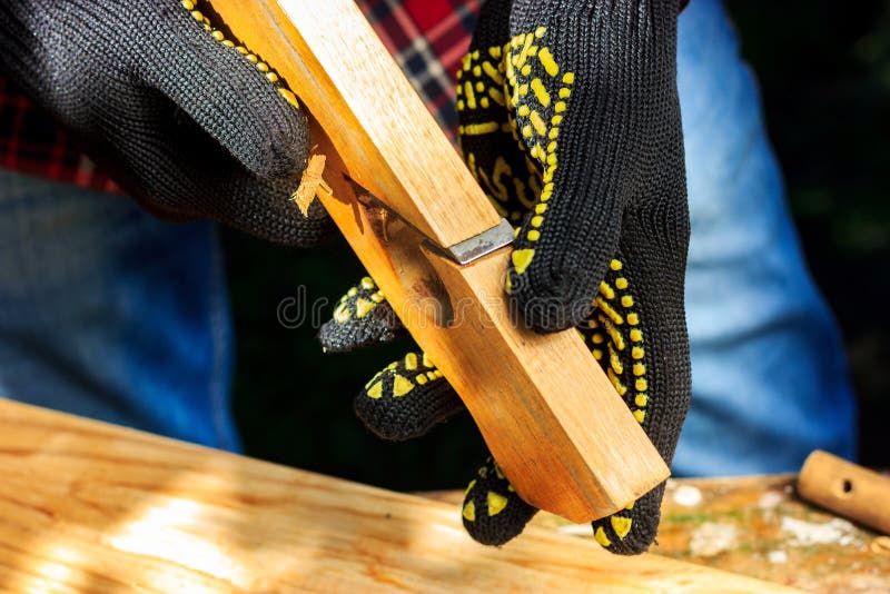 The Man Adjusts the Blade in the Plane. Carpentry Work Stock Image ...