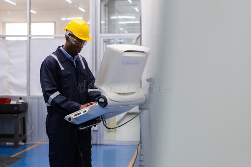 Man African American Engineer Using Computer Controlling Cnc Machine at ...