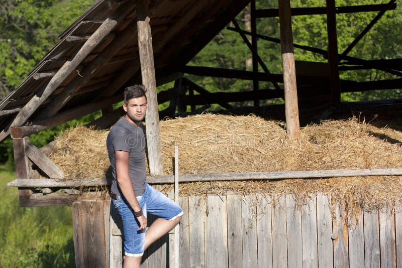 Man against stable stock image. Image of ranch, country - 25932991