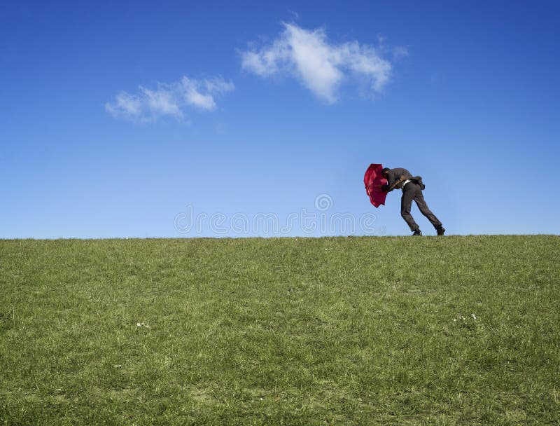 Man against wind stock photo. Image of grass, wind, struggling - 11766816