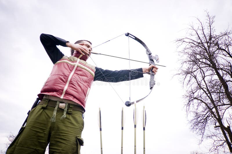 Man aiming bow stock image. Image of pulling, archer, arrows - 2532599