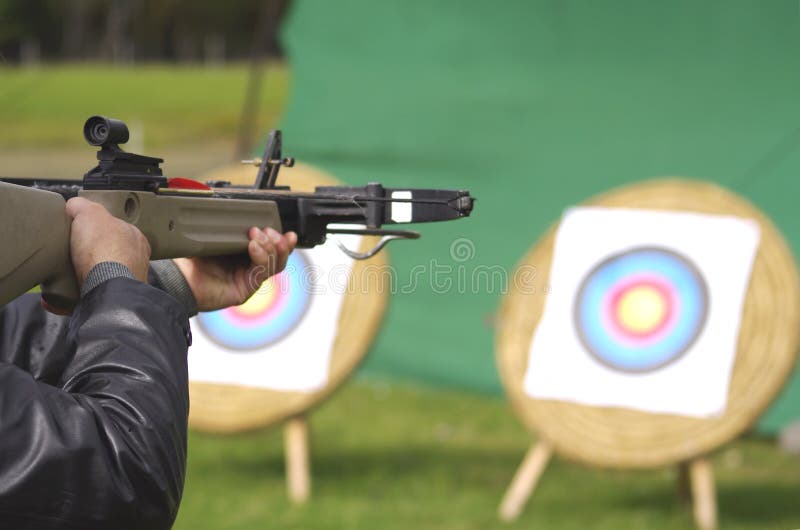 Man Aiming Crossbow at Targets Stock Photo - Image of shooter, hold ...