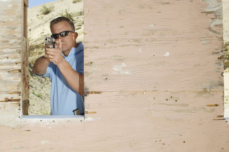 Man Aiming His Gun from the Window of a Passenger Car Stock Photo ...
