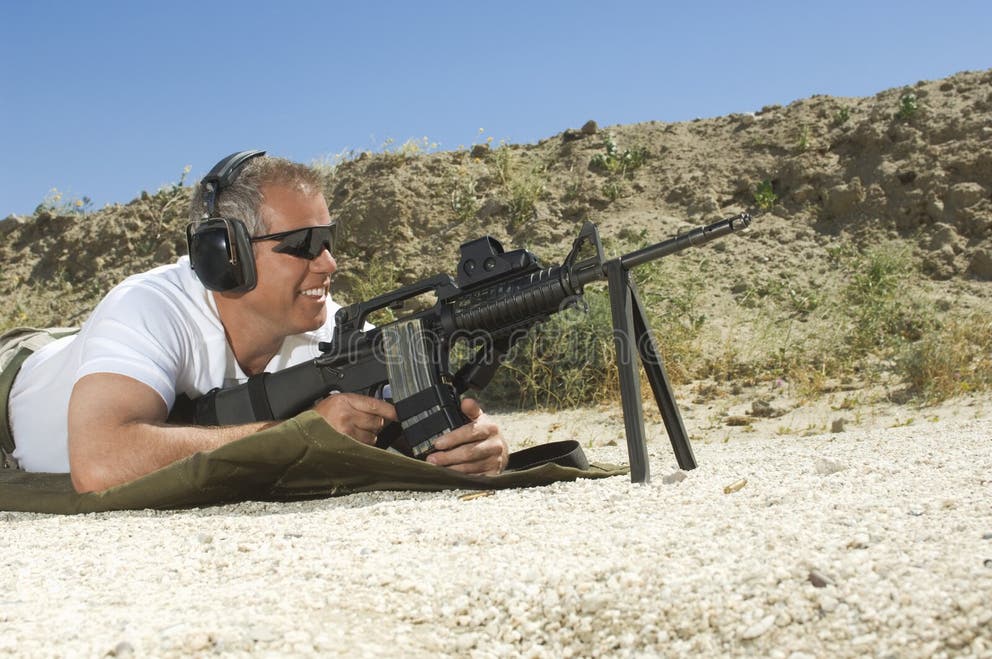Man Aiming Machine Gun stock image. Image of profession - 29660171