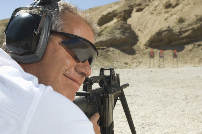 Man Aiming Machine Gun at Firing Range Stock Image - Image of firing ...