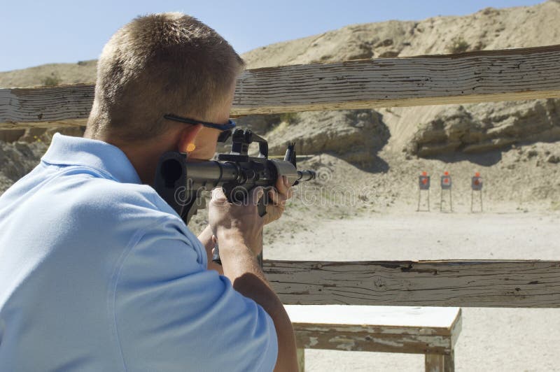 7,268 Male Aiming Gun Stock Photos - Free & Royalty-Free Stock Photos ...