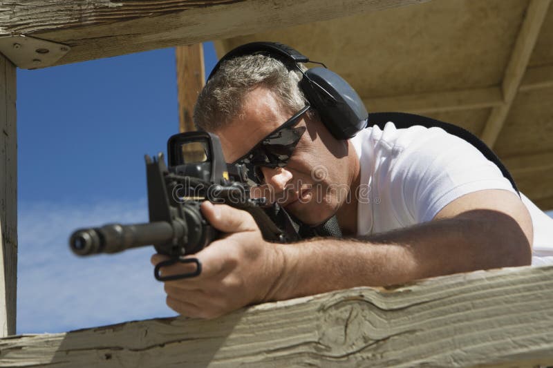 Man Aiming Machine Gun at Firing Range Stock Photo - Image of army ...