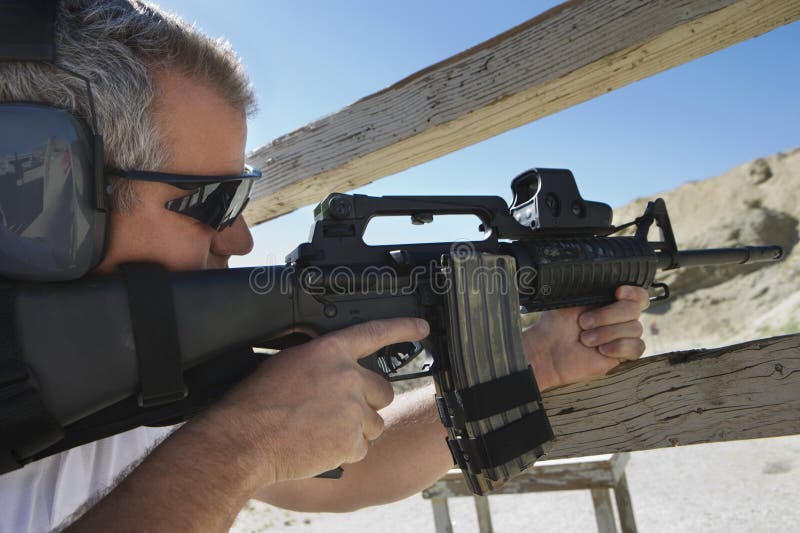 Man Aiming Machine Gun at Firing Range Stock Image - Image of firing ...