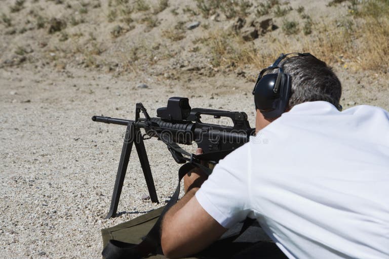 Man Aiming Machine Gun at Firing Range Stock Image - Image of officer ...