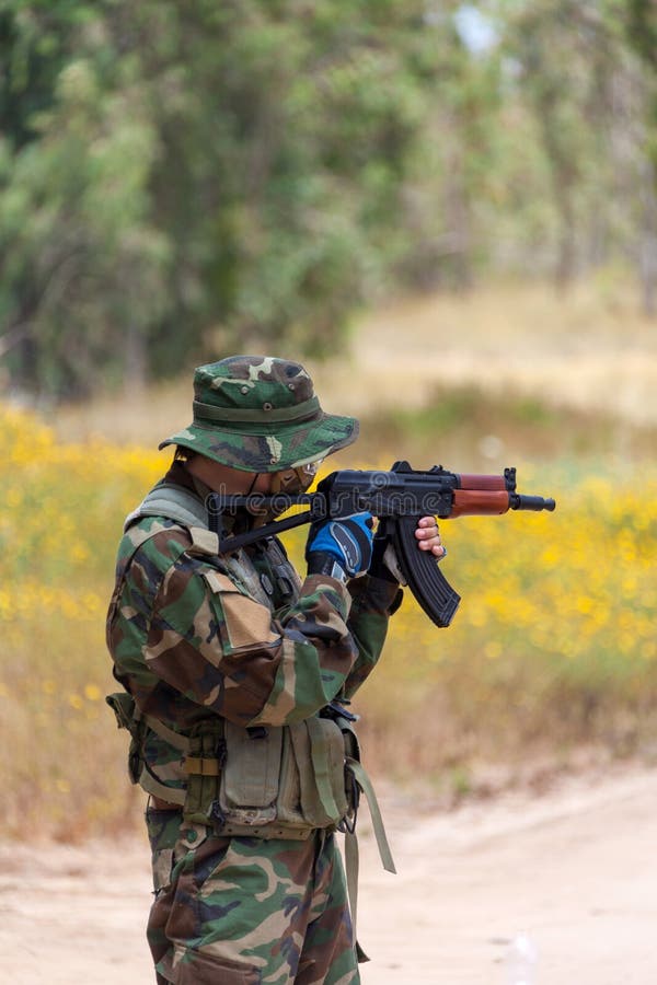 Man with AK Holds at Gunpoint Stock Image - Image of force, rifle: 40615919